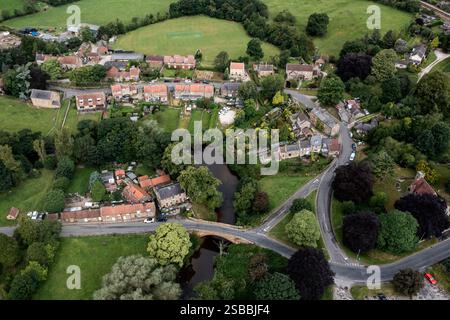 Aerial view Lealholm Village alongside the River Esk, North York Moors ...