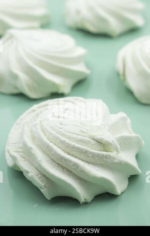Marshmallows on plate on light background Stock Photo - Alamy