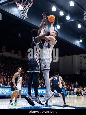 Saint Mary's center Mitchell Saxen (11) shoots while defended by Oregon ...