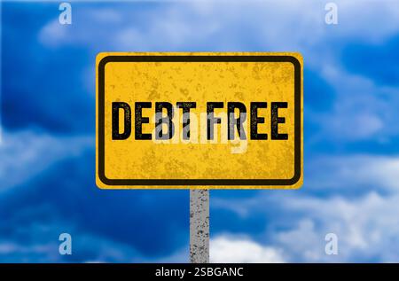 Debt free message written on wooden block with green background ...