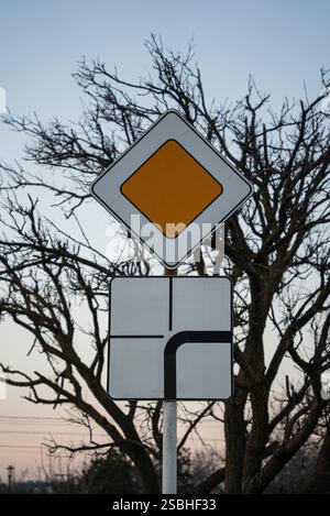 road sign the main road changes direction Stock Photo - Alamy