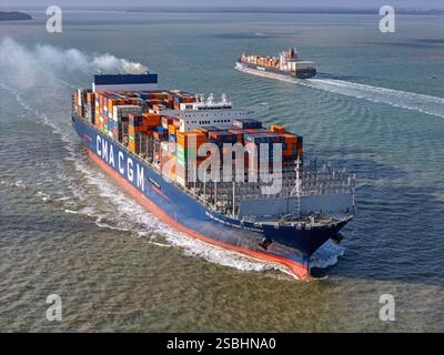 An aerial view of container ships passing at sea. CMA CGM Antoine de ...