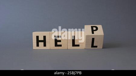 Help vs Hell symbol. Turned wooden cube with words Hell and Help ...