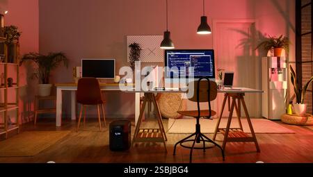Interior of dark programmer's office with workplace and glowing lamp ...