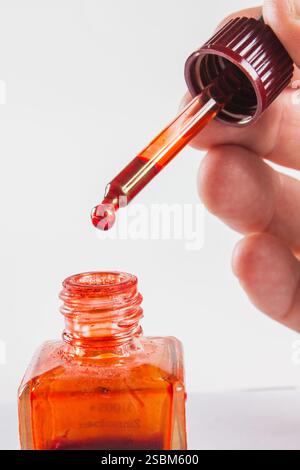 pipette with ink isolated on white background Stock Photo - Alamy