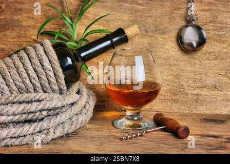 bottle of wine wrapped with rope on the background of the old wooden ...