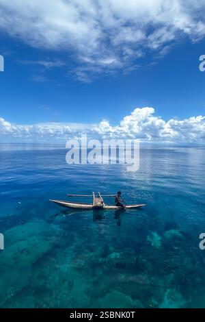 Residents of Vitu Islands in their traditional dugout canoes, Garove ...