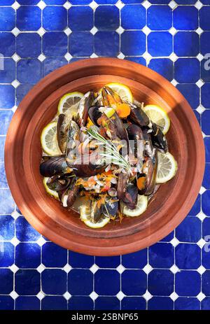 Morocco, Sidi Bennour province, Oualidia, sea food in a terracotta dish ...