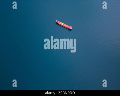 An aerial perspective of cargo ships floating on the open sea ...