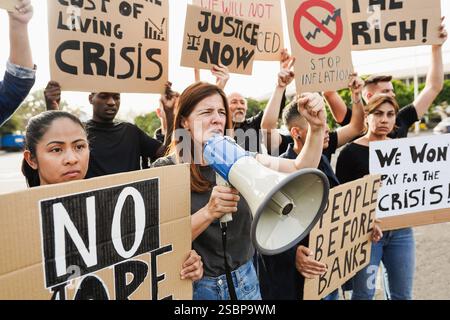 Crowd of multiracial people protest against inflation and financial ...