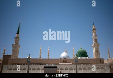 A green dome and minarets in Prophet Mosque in Madinah, also known as ...