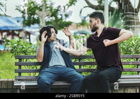 two teenagers communicate and argue outdoor in the park Stock Photo - Alamy