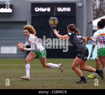 Harlequins Women’s Ellie Kildunne runs at Exeter Chiefs Women’s Katie ...