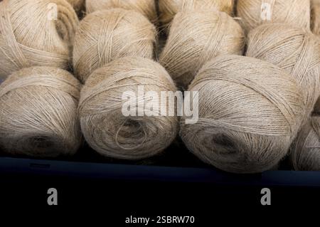 Plenty of spools or rolls of brown color linen string Stock Photo - Alamy