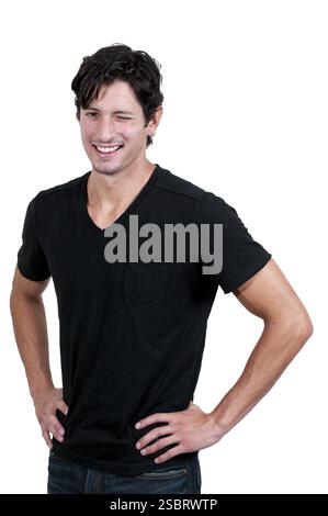 Flirting young handsome man winking and smiling Stock Photo - Alamy