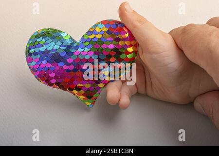 Hearts cut out of bright color foam sheets viewed in full frame ...