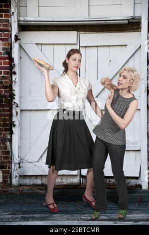 Beautiful woman having a friendly pie fight Stock Photo - Alamy