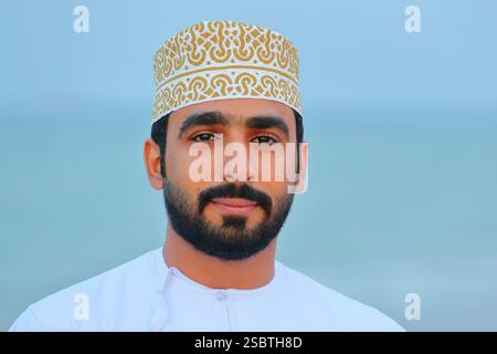 MUSCAT BEACH, MUSCAT, OMAN - DECEMBER 31, 2024: Portrait of a welcoming ...