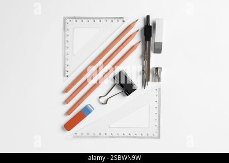 Flat lay composition with ruler and other stationery on white ...