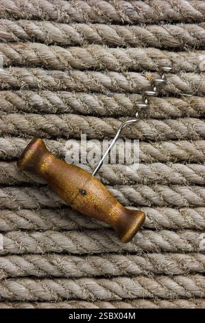 corkscrew on the background of hemp rope Stock Photo - Alamy