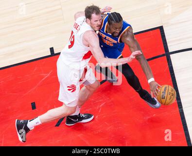 New York Knicks' Ariel Hukporti, left, and Josh Hart high-five during ...