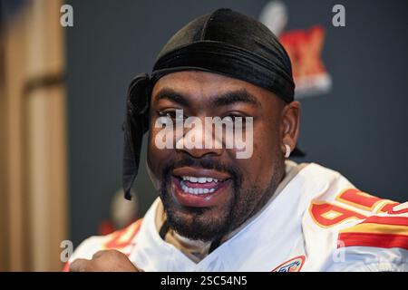 Kansas City Chiefs' Chris Jones (95) and Mike Danna (51) walk off the ...