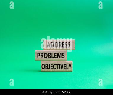 Address Problems Objectively symbol. Wooden blocks with words Address ...
