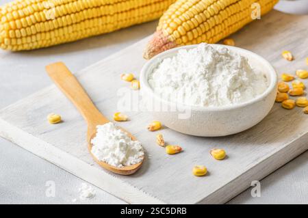Bowl with corn starch and kernels on table Stock Photo - Alamy