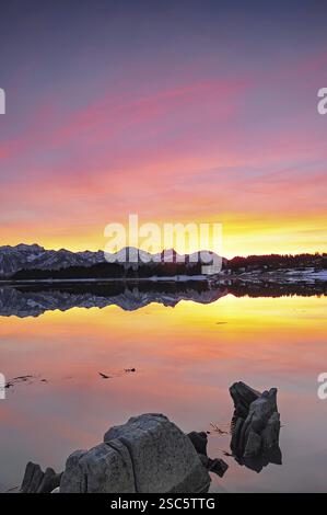Sunset at the Forggensee near Fuessen in the Allgaeu, on the left the ...