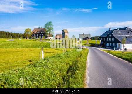 Road to Jizerka village with traditional mountain houses and ...