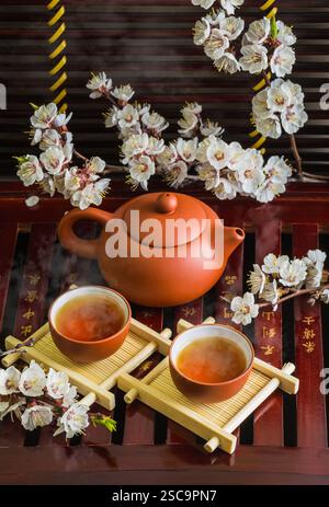 Ancient Chinese tea set with spring flowers Stock Photo - Alamy