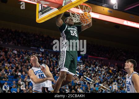Michigan State forward Coen Carr dunks during the first half of an NCAA ...