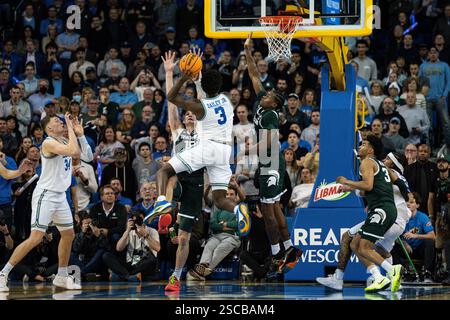 Michigan State forward Coen Carr throws down a reverse dunk during the ...