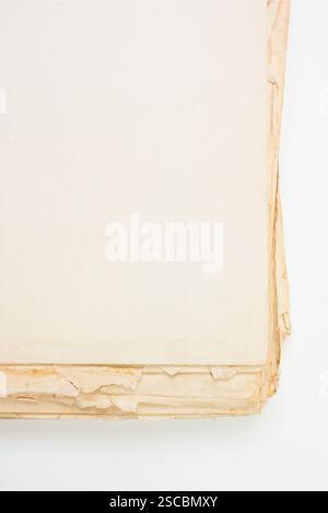 An old book with a crumpled sheet and hardcover isolated on white ...