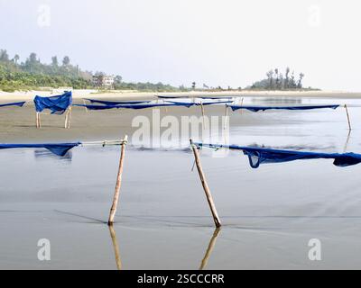 Tidal fishing nets set up along Cox’s Bazar beach in Inani, Bangladesh ...