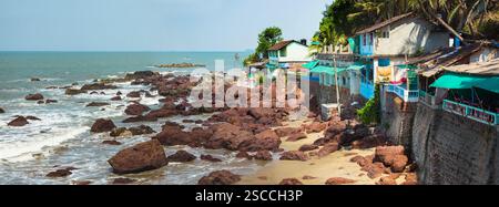 Arambol beach, stones, houses, North Goa, India Stock Photo - Alamy