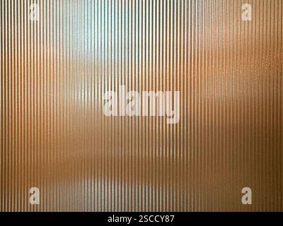 Texture of matt golden bronze fluted glass, or striped glass. Fluted ...