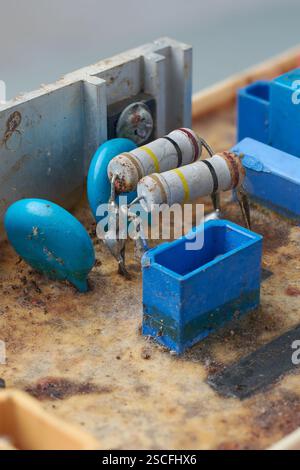 close-up of damaged or disassembled various components of circuit board ...