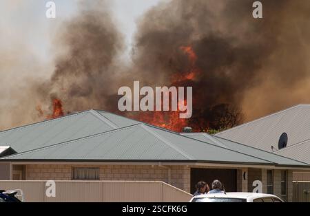 Flames and dense smoke from a bushfire close to homes in Esperance WA ...