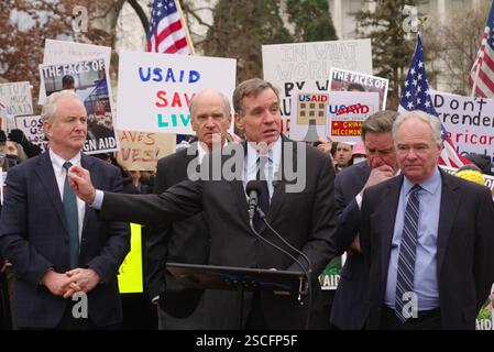 Sen. Mark Warner, D-Va., speaks with reporters at the Capitol Subway on ...