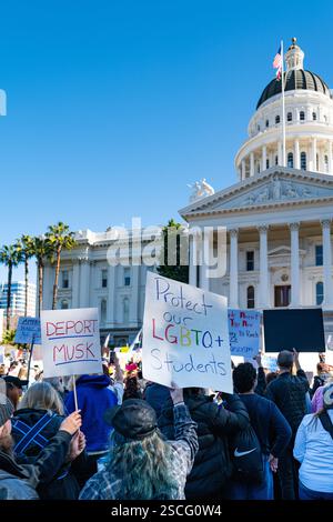 Protesters with anti-Elon Musk signs face off against a Trump and DOGE ...