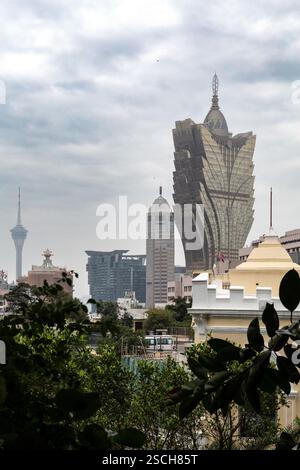 Iconic Grand Lisboa building under cloudy skies in Macau Stock Photo ...