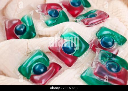 Laundry detergent capsules on beige fabric, top view Stock Photo - Alamy