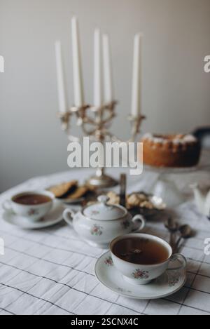 Tea party, with tea pot,tea cups and gourmet mini cake; Studio Shot ...