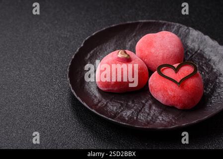 Delicious sweet mochi in the shape of red hearts for the holiday of ...