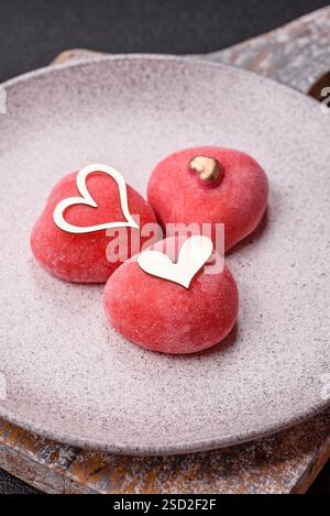 Delicious sweet mochi in the shape of red hearts for the holiday of ...