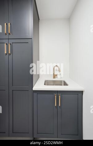 Well organized small home kitchen interior with sink under window and ...