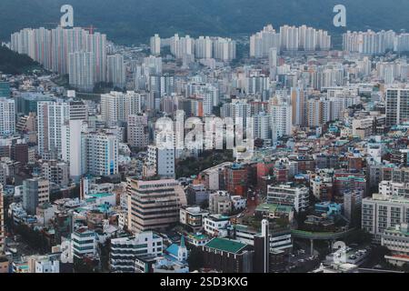 South korean cityscape featuring a lively port, green hills, and a mix ...