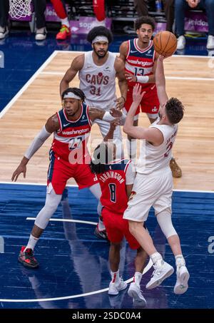 Cleveland Cavaliers guard Ty Jerome, left, passes over Miami Heat ...