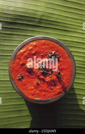 Small bowl with red Chillies on wooden background Stock Photo - Alamy